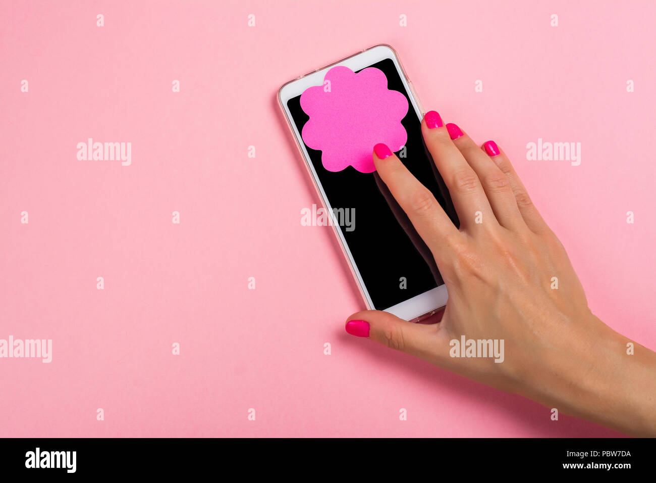 Female hand reaching for cell phone Stock Photo - Alamy