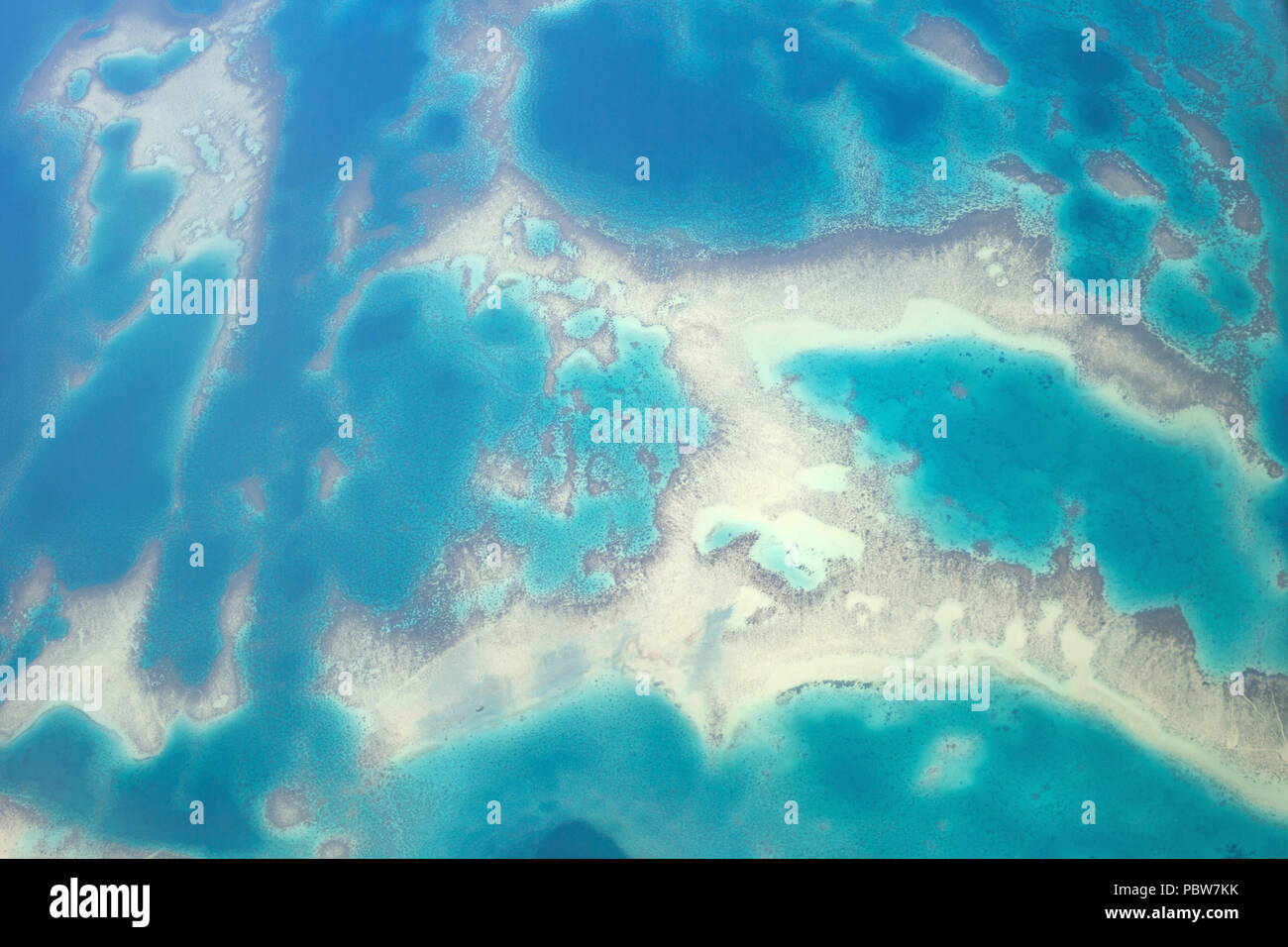 Aerial view of Red sea with coral reefs & sand islands. Abstract ...