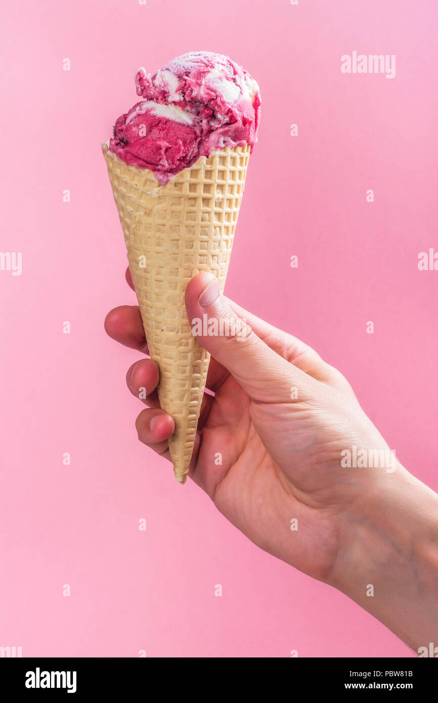 Hand holding an ice cream cone hi-res stock photography and images - Alamy
