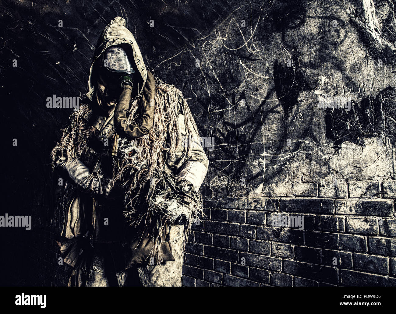 Post apocalyptic creature in gas mask armed gun Stock Photo - Alamy