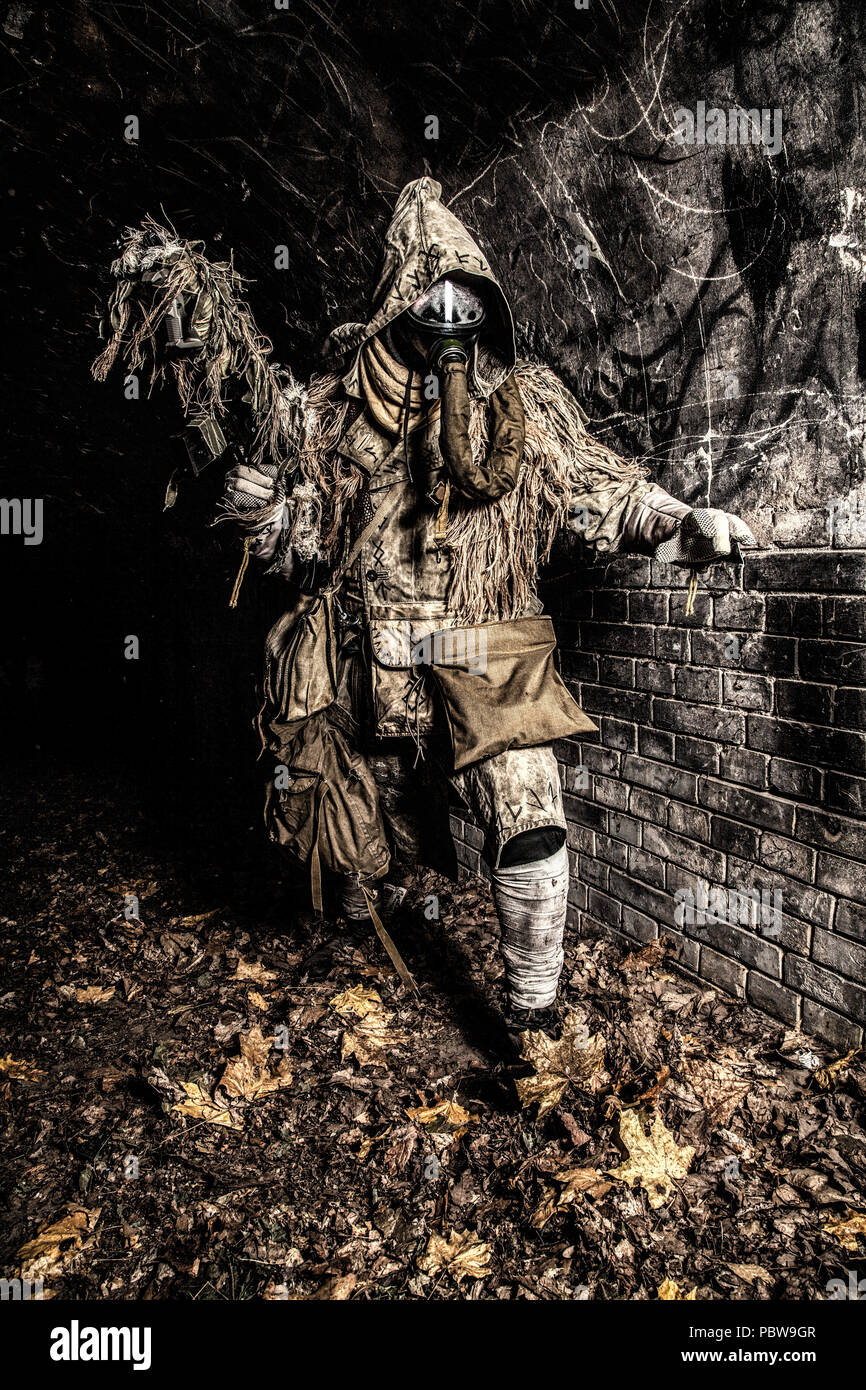 Post apocalyptic creature in gas mask armed gun Stock Photo - Alamy