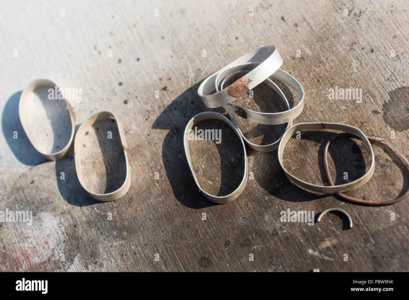 metal pieces of round ring shape on dark background Stock Photo - Alamy