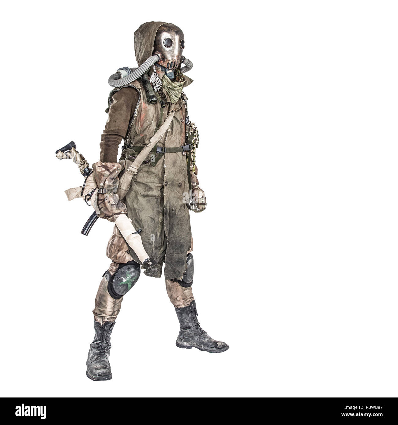 Post apocalyptic creature in gas mask armed by gun Stock Photo - Alamy