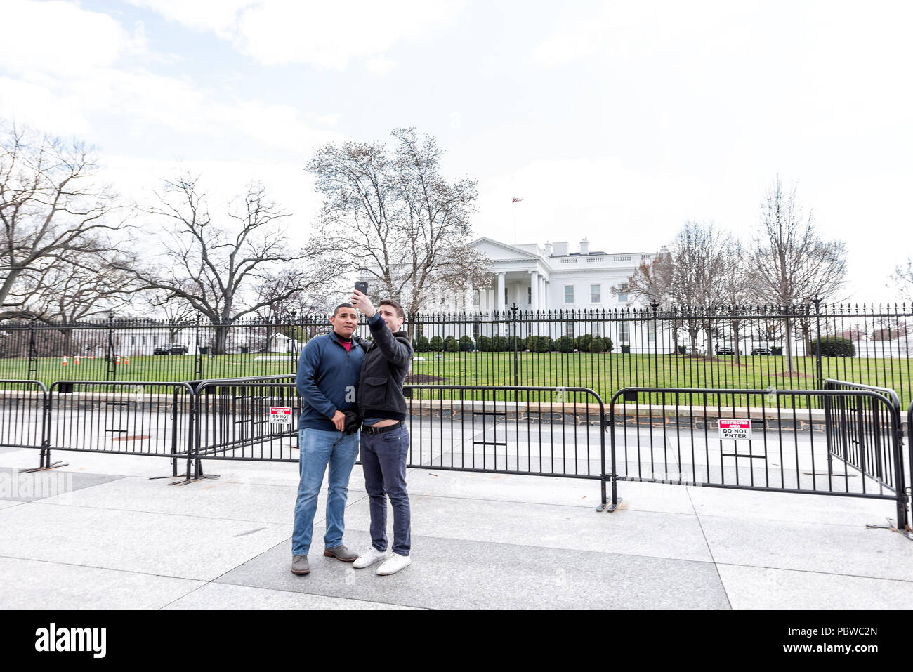 Washington DC, USA - March 9, 2018: Couple of young men people in front ...