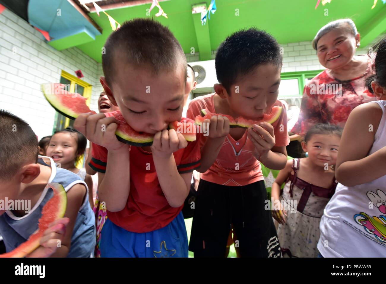 Watermelon eating contest hi-res stock photography and images - Alamy