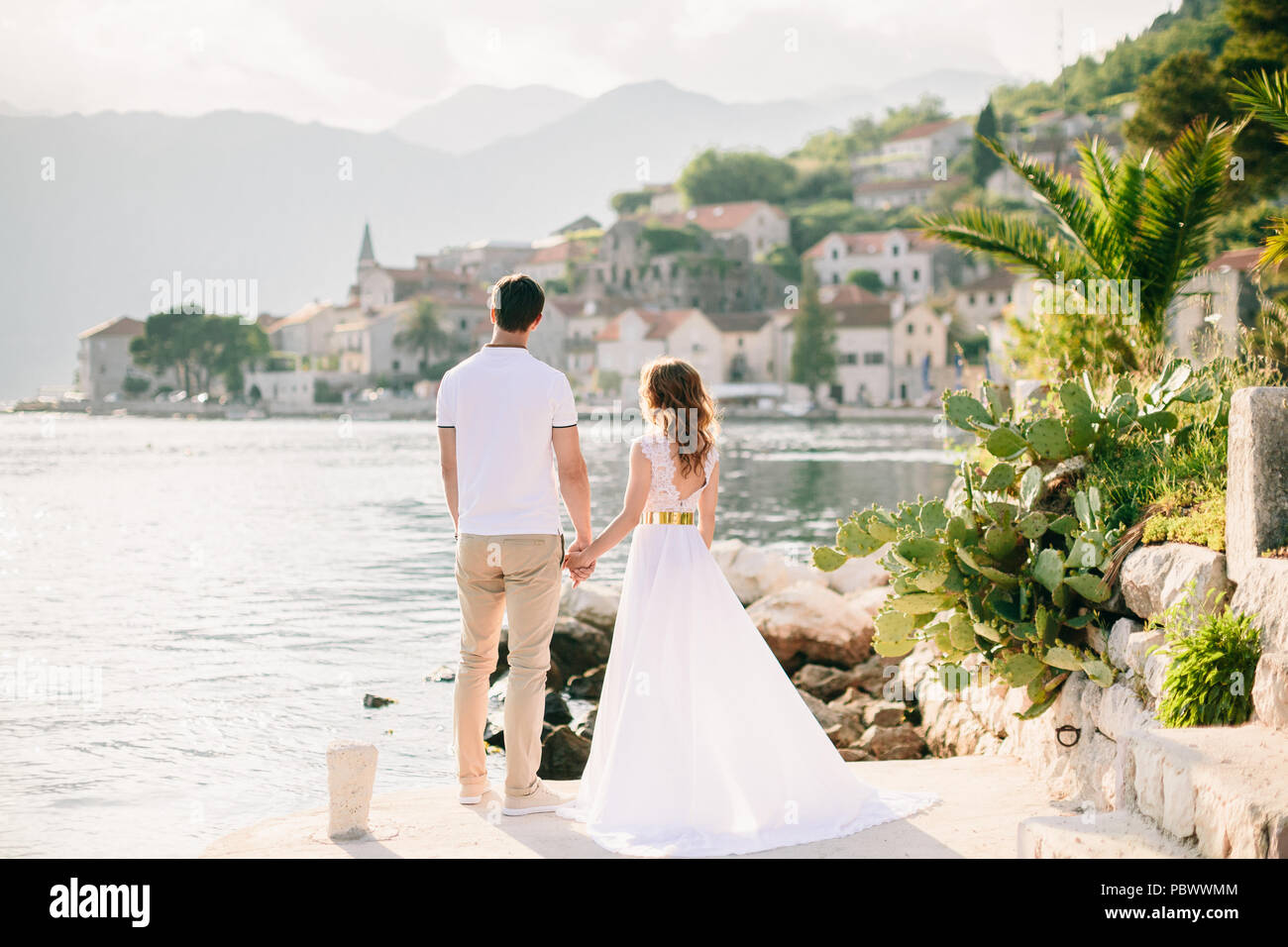 honeymoon couple travel sea and beach resort in Europe. Back view. Sea ...