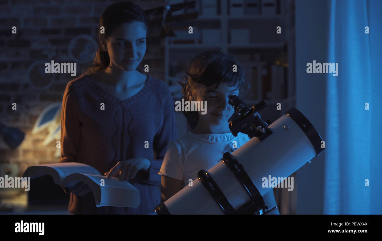 Child using a telescope with stars hi-res stock photography and images ...