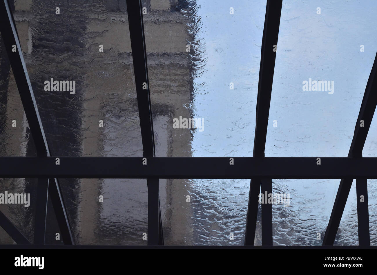 A heavy rain is pouring through the window in the daytime Stock Photo ...