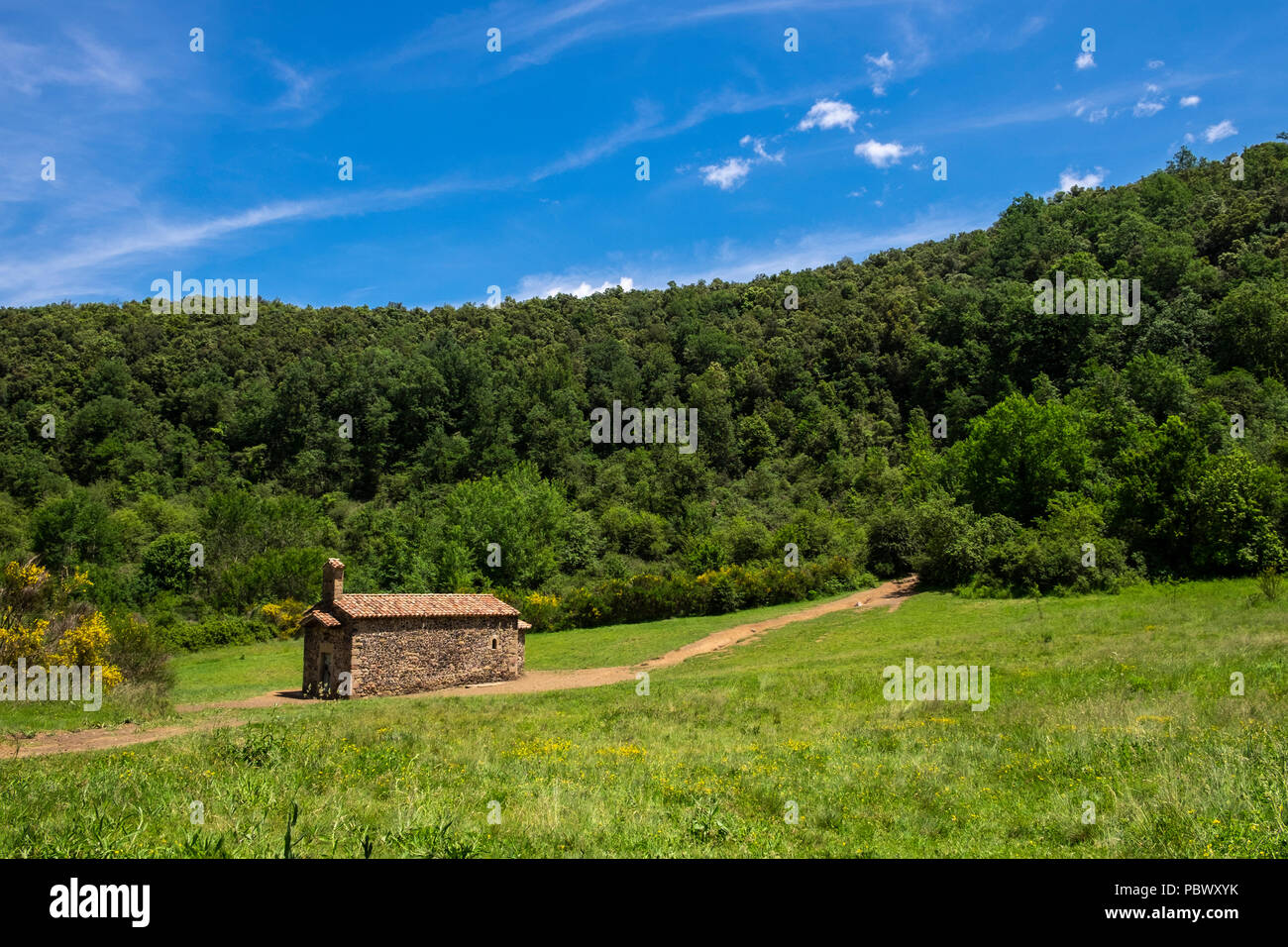 Crater and church building in the Santa Margarida volcano in summer ...