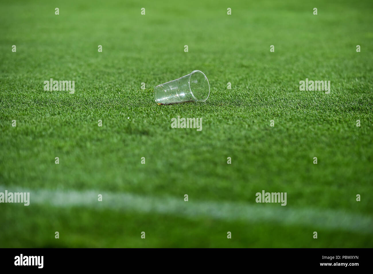 Plastic trash can on the turf on a soccer field Stock Photo - Alamy