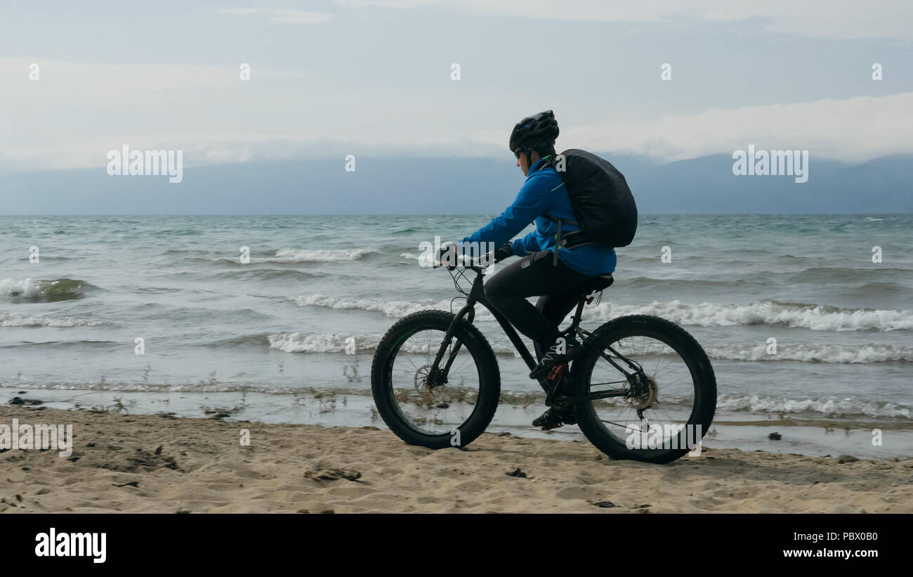 Fat bike also called fatbike or fat-tire bike in summer driving on the ...