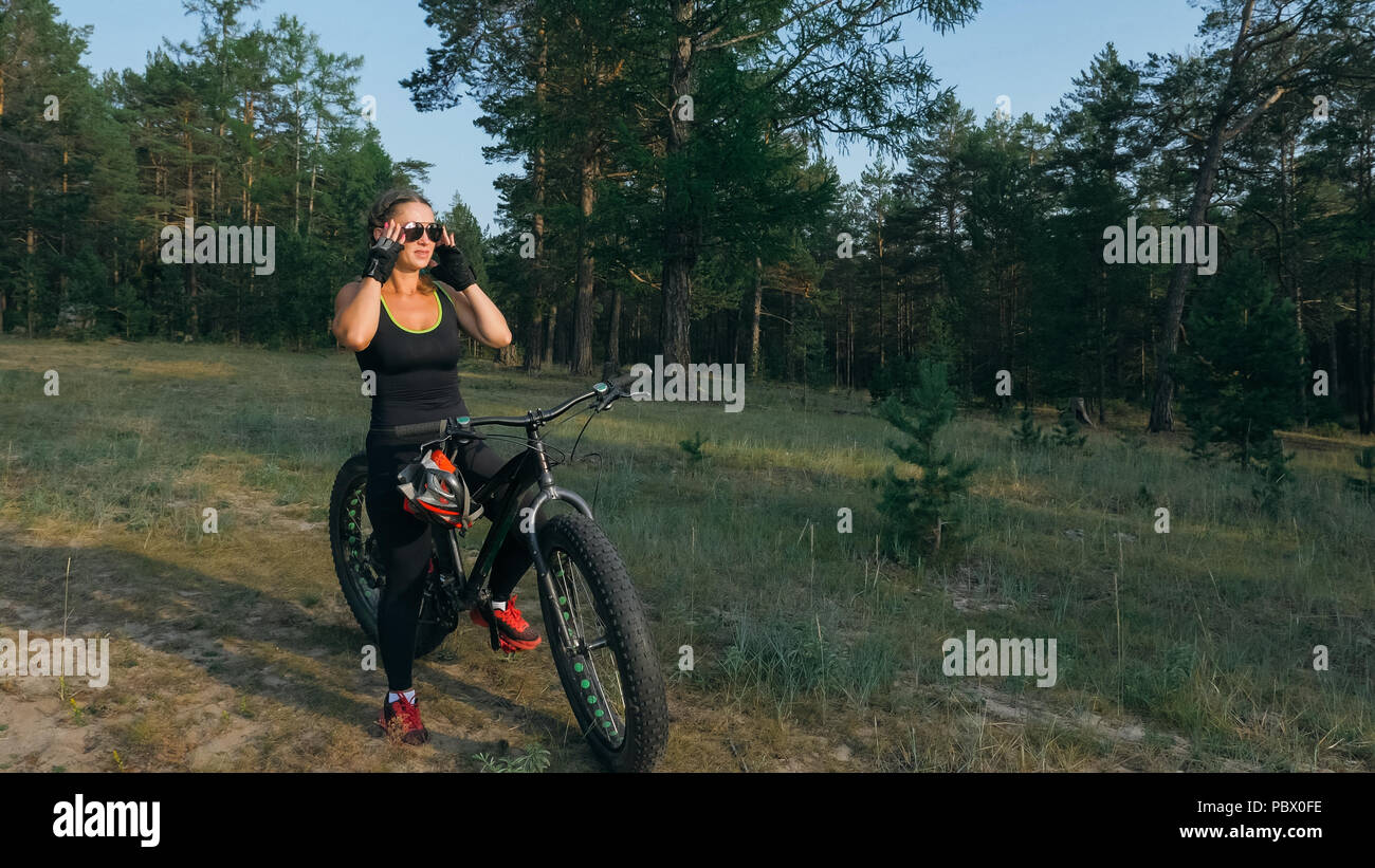 Fat bike also called fatbike or fat-tire bike in summer riding in the ...