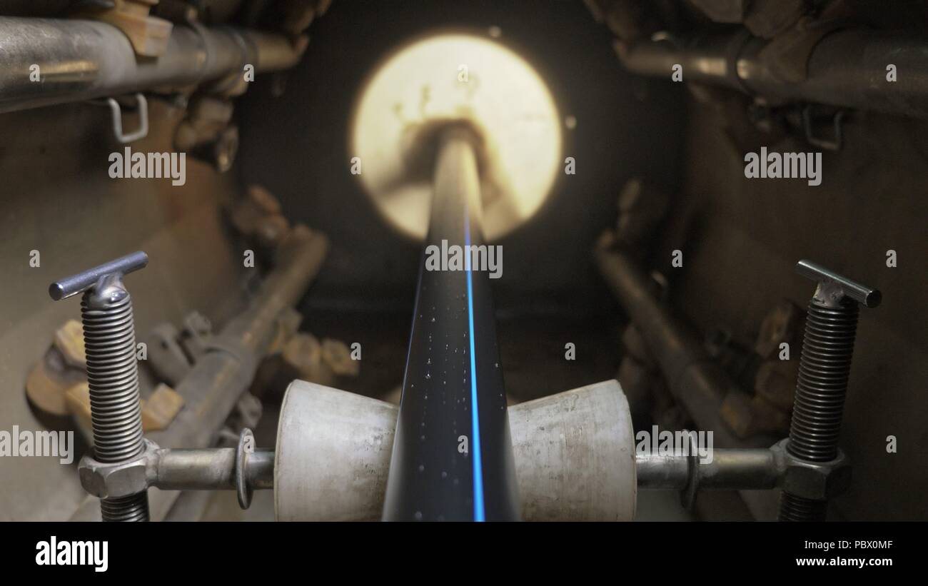 Pipes manufacturing production line. Manufacture of plastic water pipes ...