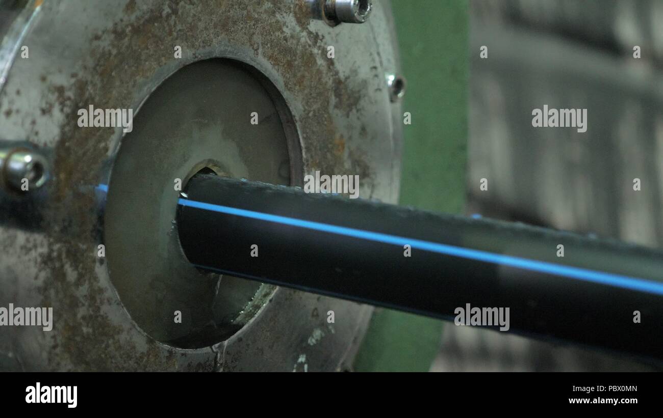 Pipes manufacturing production line. Manufacture of plastic water pipes ...
