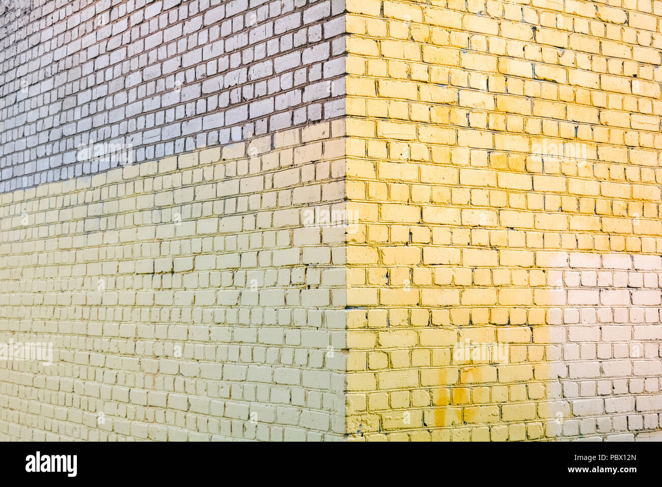 Yellow and gray stone bricks wall texture. Urban paintetd bricks as ...