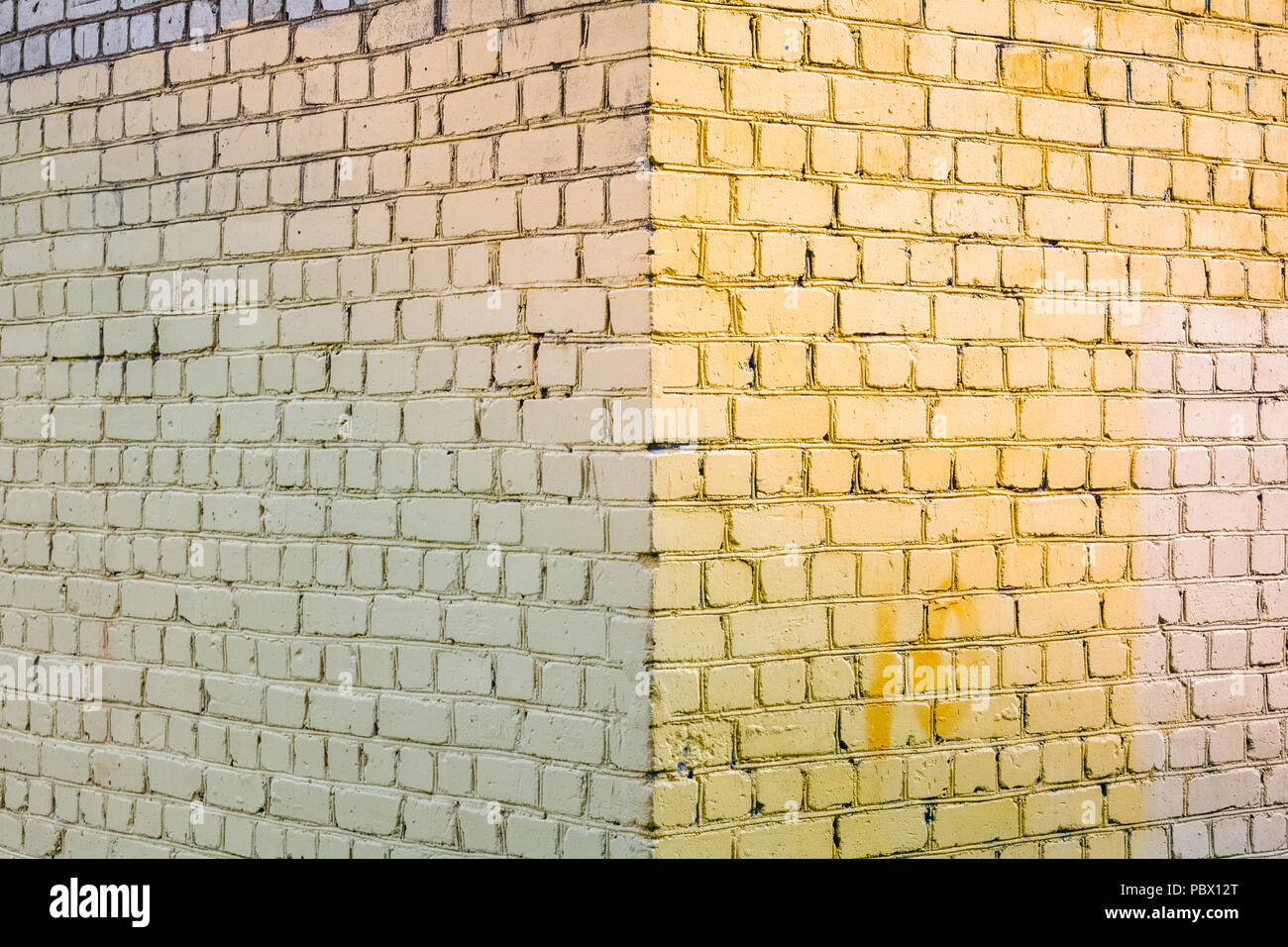 Yellow and gray stone bricks wall texture. Urban paintetd bricks as ...