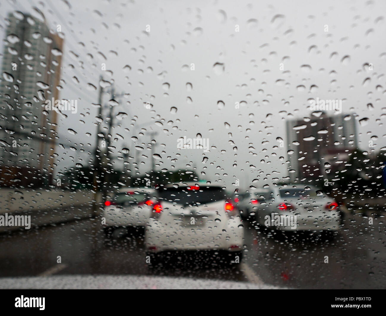 Traffic jam in rainy day with raindrops on car glasses Stock Photo - Alamy