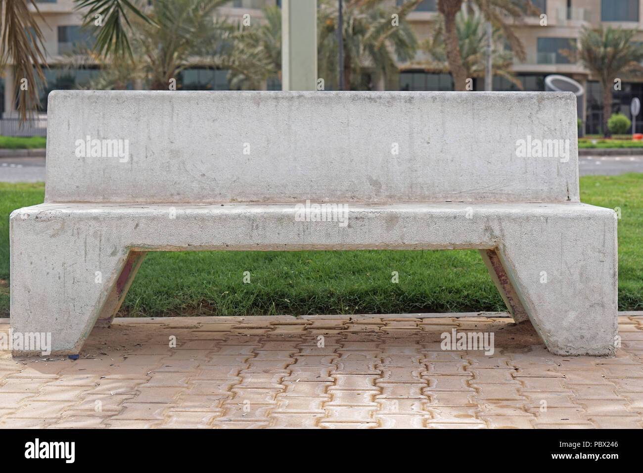 White concrete bench in Kuwait park Stock Photo - Alamy