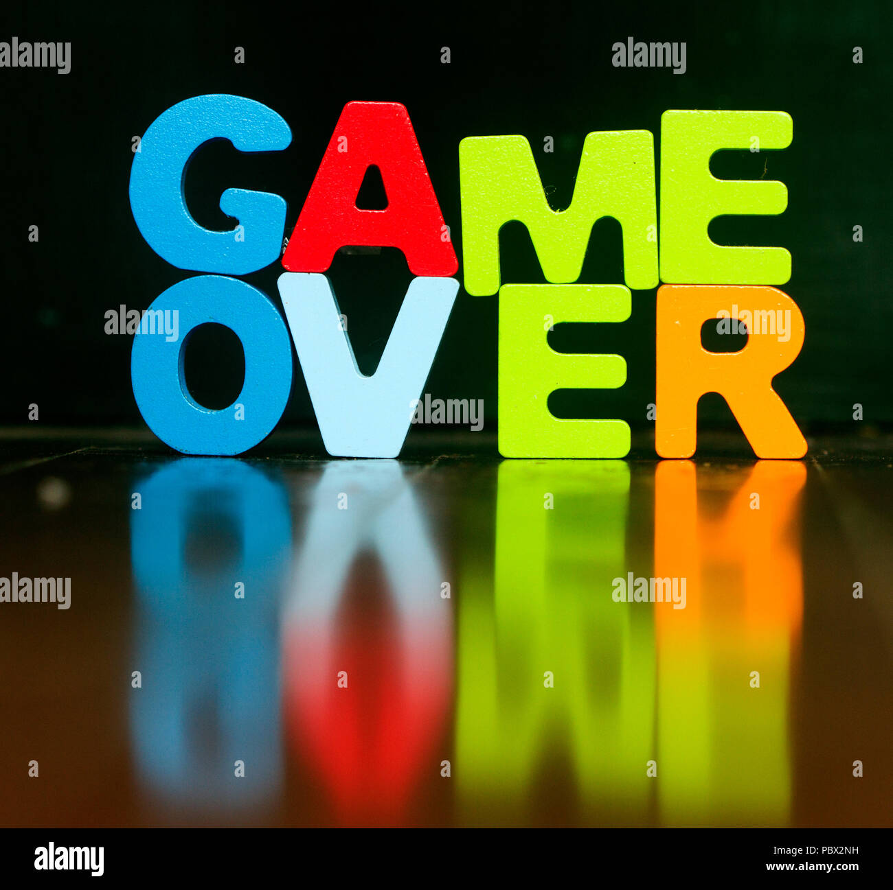 GAME OVER woth wooden letters and reflection Stock Photo - Alamy