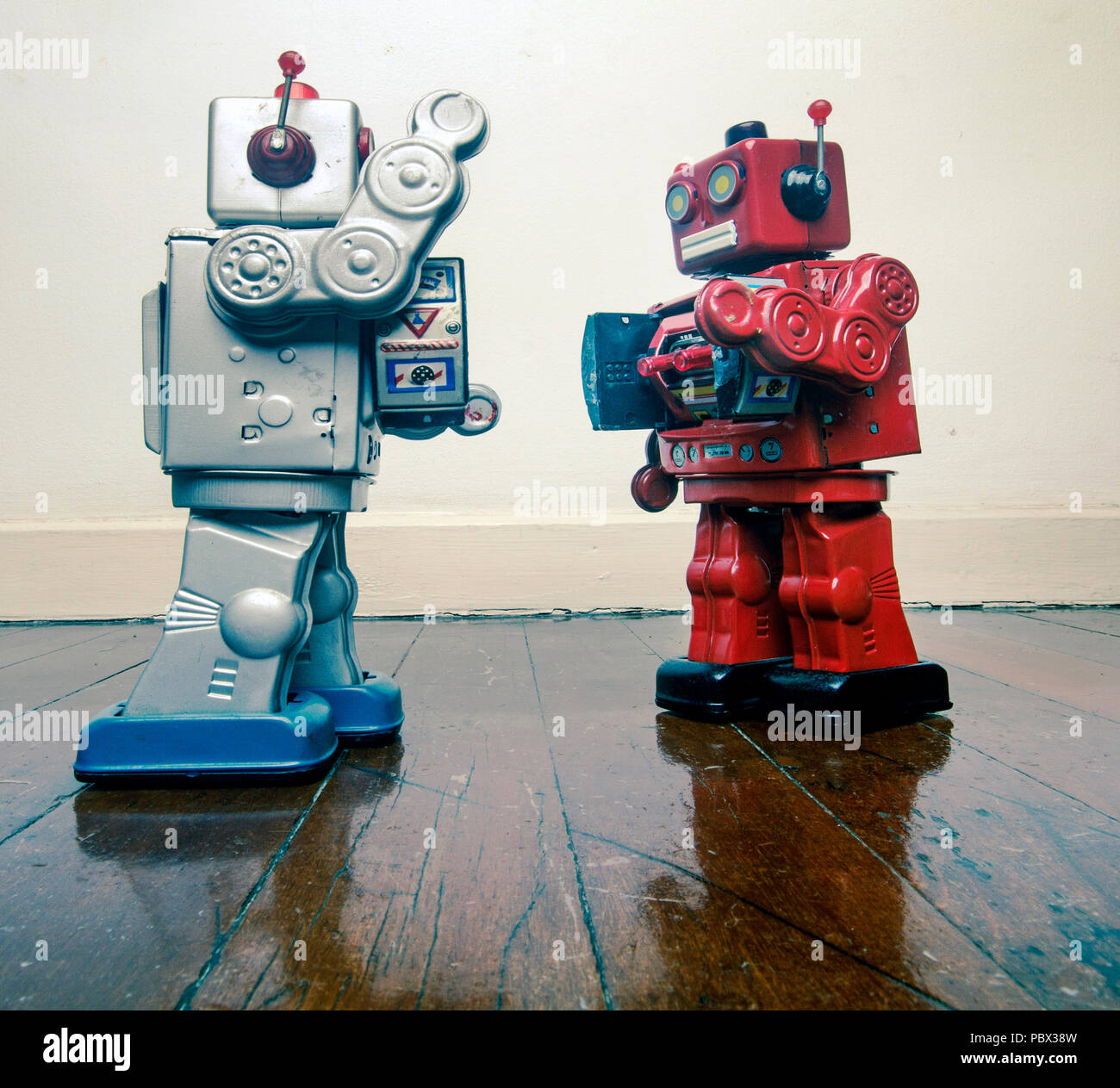 fight club robot concept on a wooden floor Stock Photo - Alamy