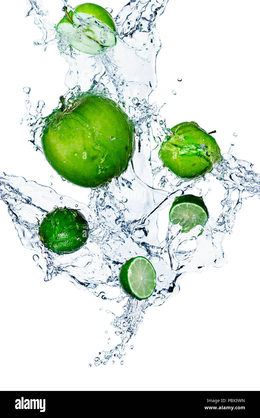 Splash of water and fruit on white background Stock Photo - Alamy