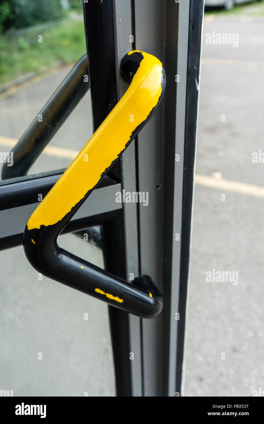used door handle from telephone cabin yellow Stock Photo - Alamy