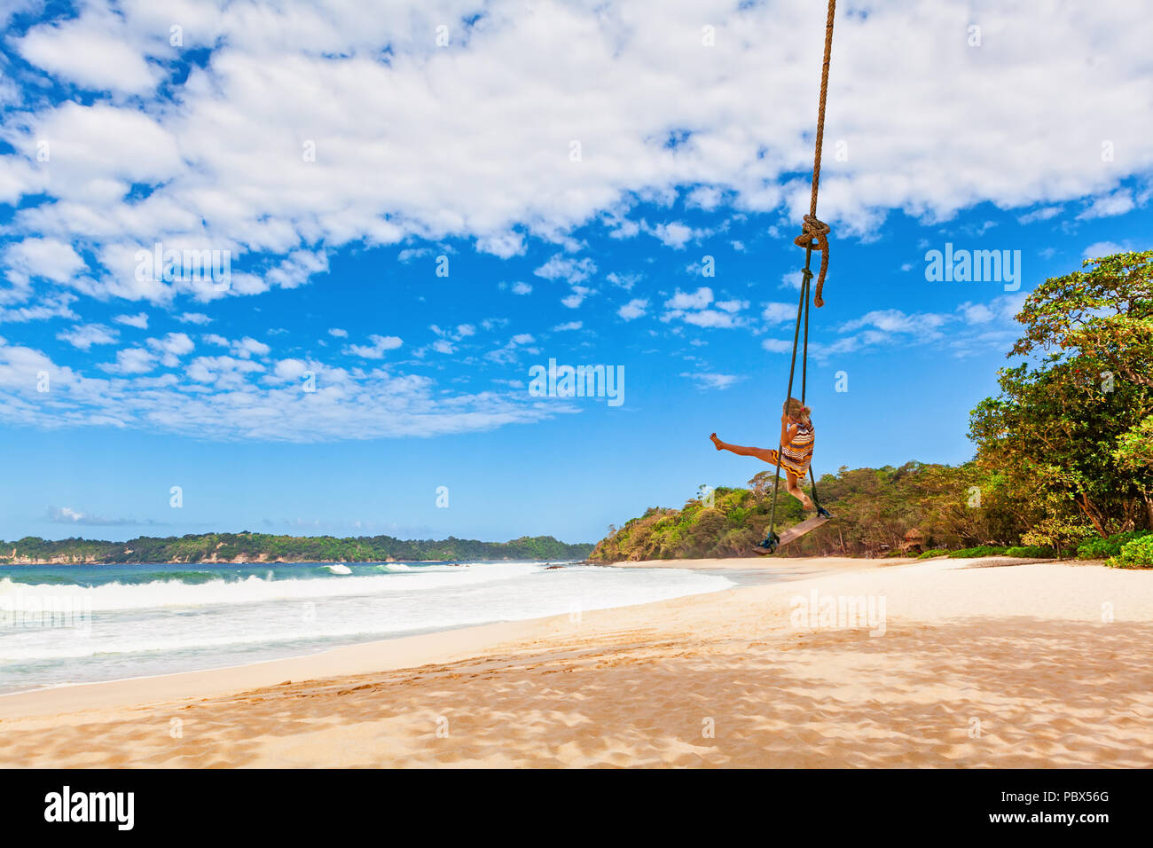 Family on beach on swing hi-res stock photography and images - Alamy