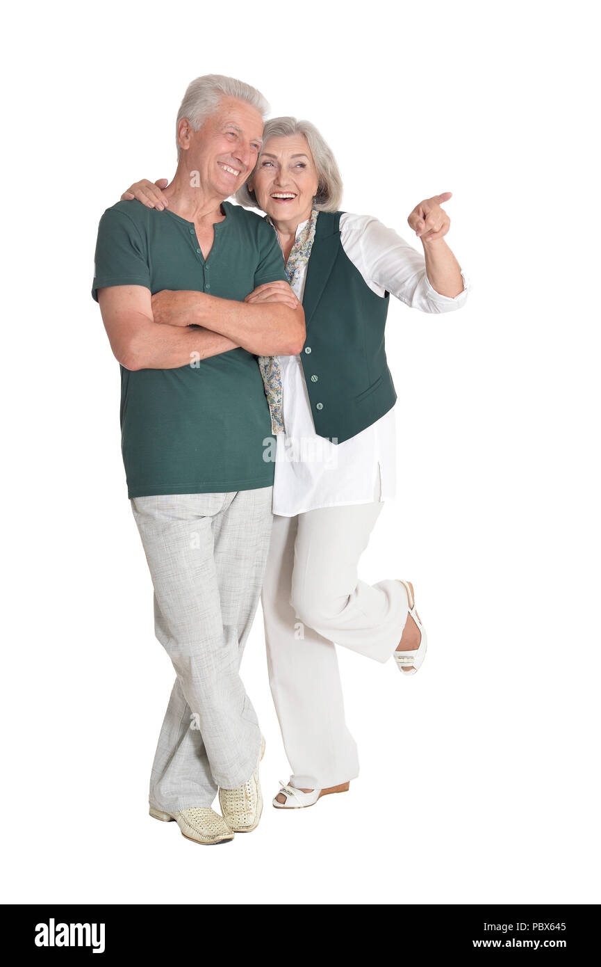 portrait of senior couple pointing something isolated Stock Photo - Alamy