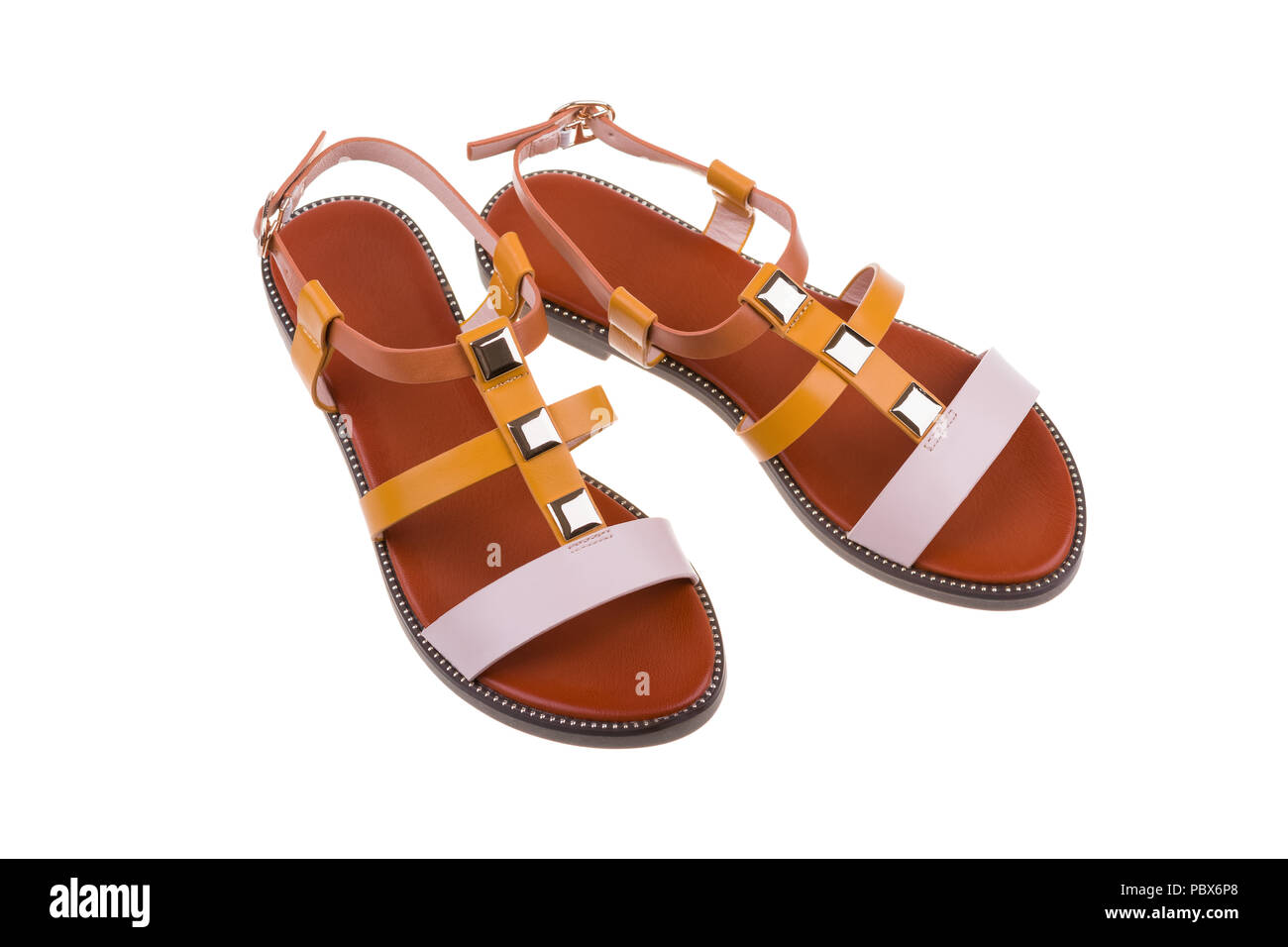 Pair of women's sandals isolated on white background Stock Photo - Alamy