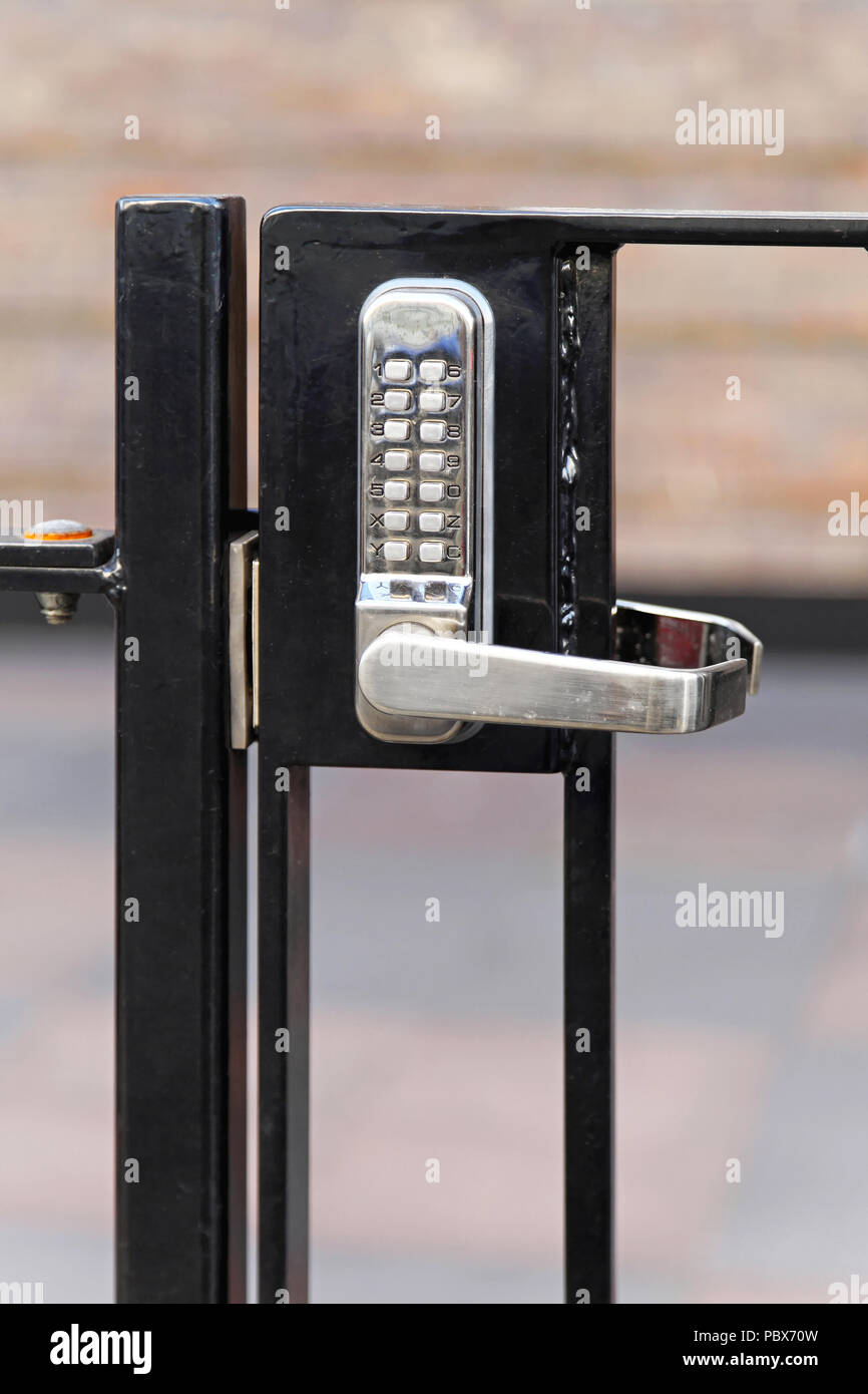 Electronic lock with pin code at fence Stock Photo - Alamy