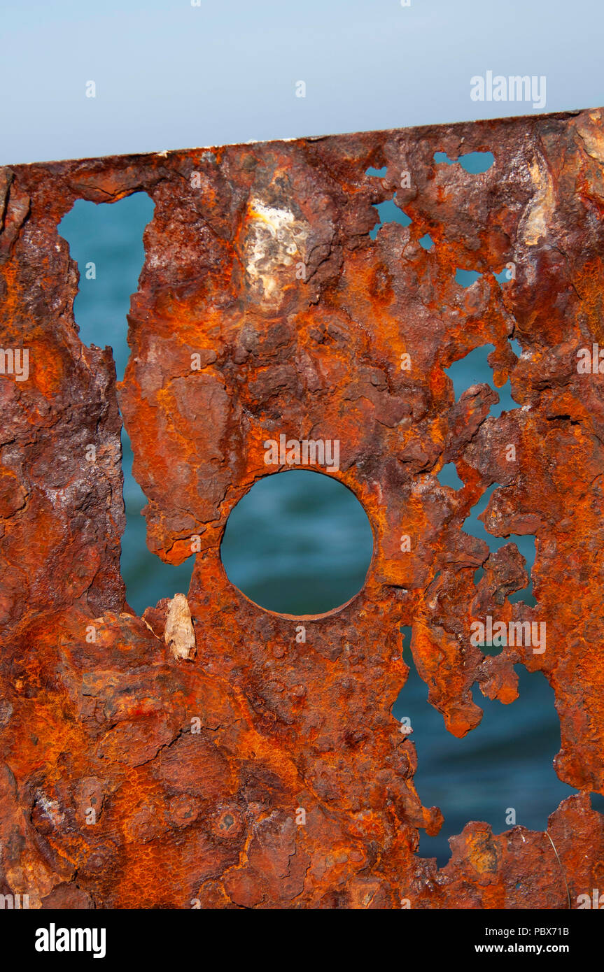 Rusty port bulkhead with tangled fishing lines Stock Photo - Alamy