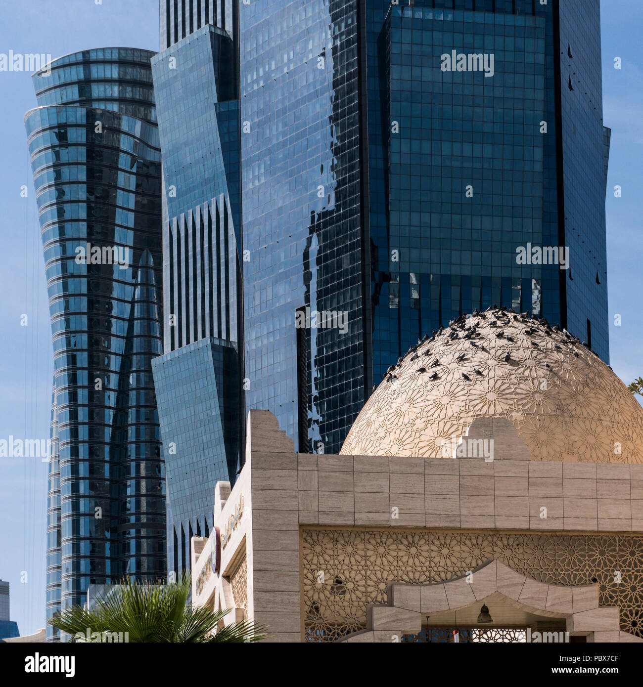 DOHA, QATAR - FEB 2018: Compilation of Mosque Dome and Modern Blue High ...