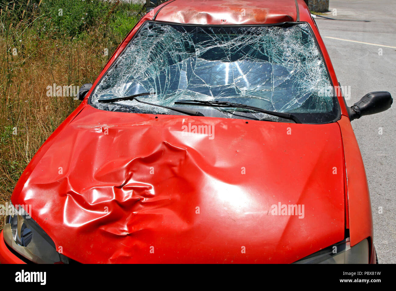 Damaged Red Car
