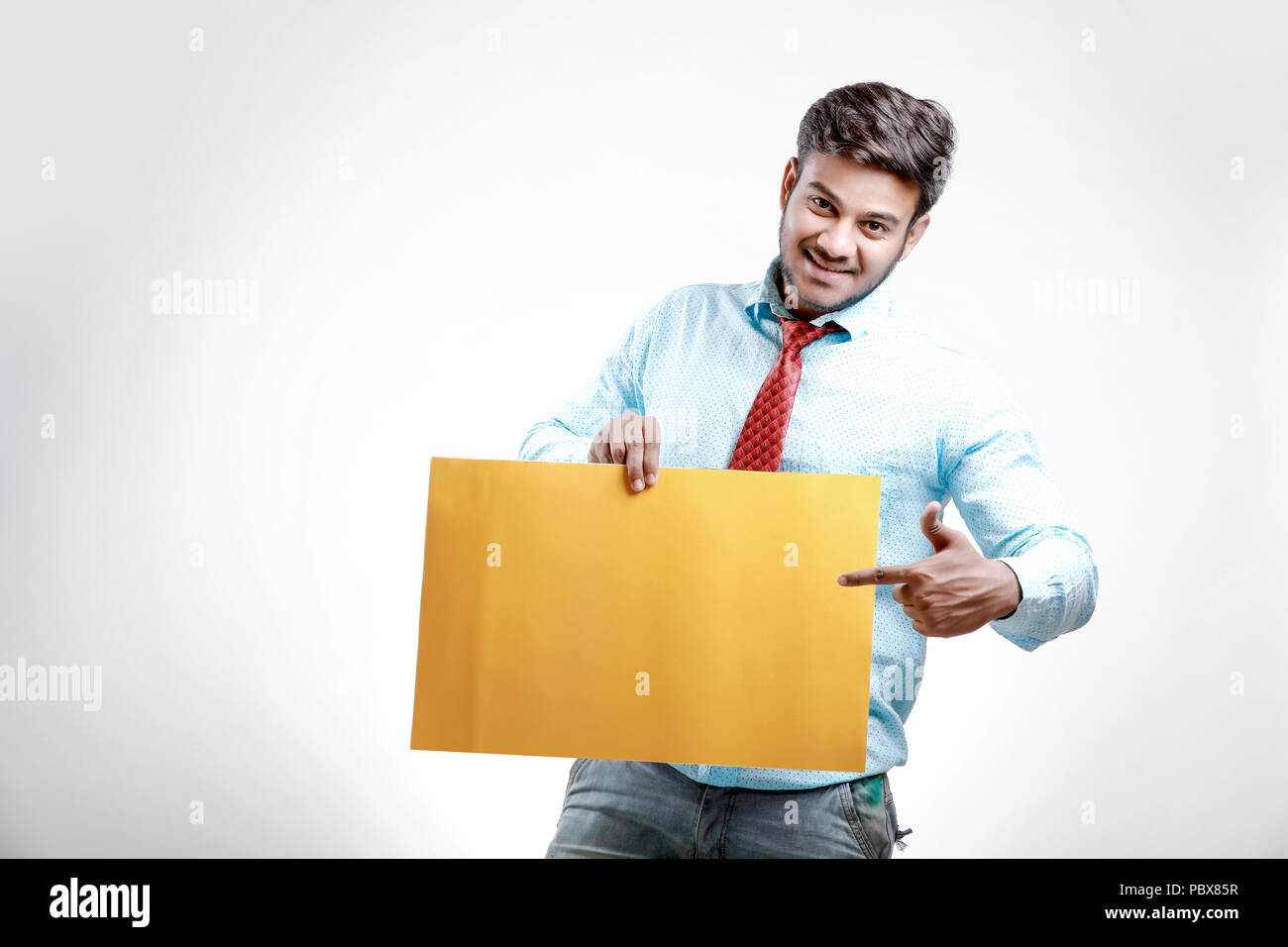 Asian guy showing blank hi-res stock photography and images - Alamy