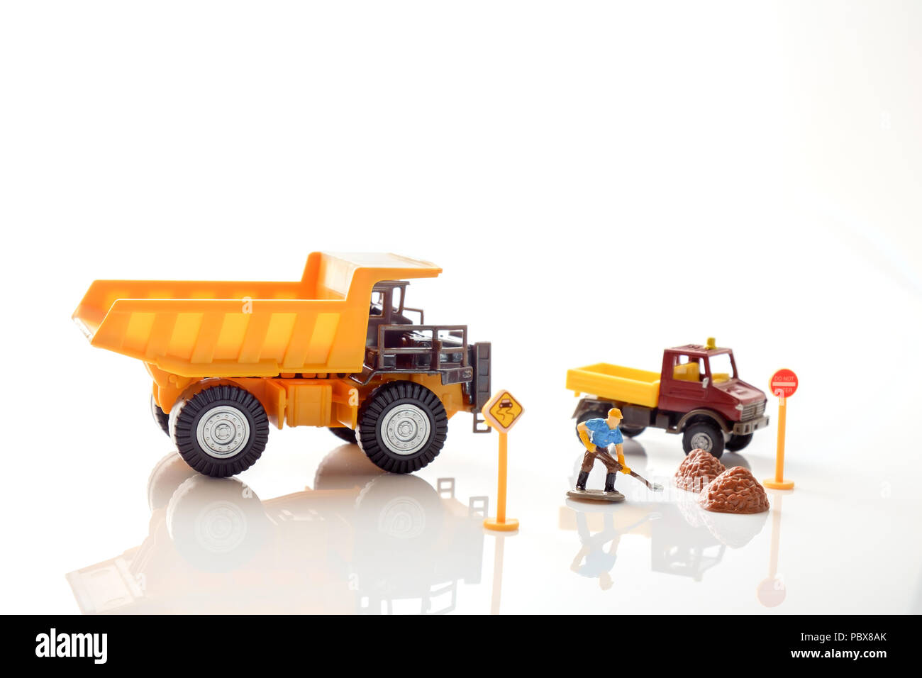 View of construction site of mini toy worker on white background Stock ...