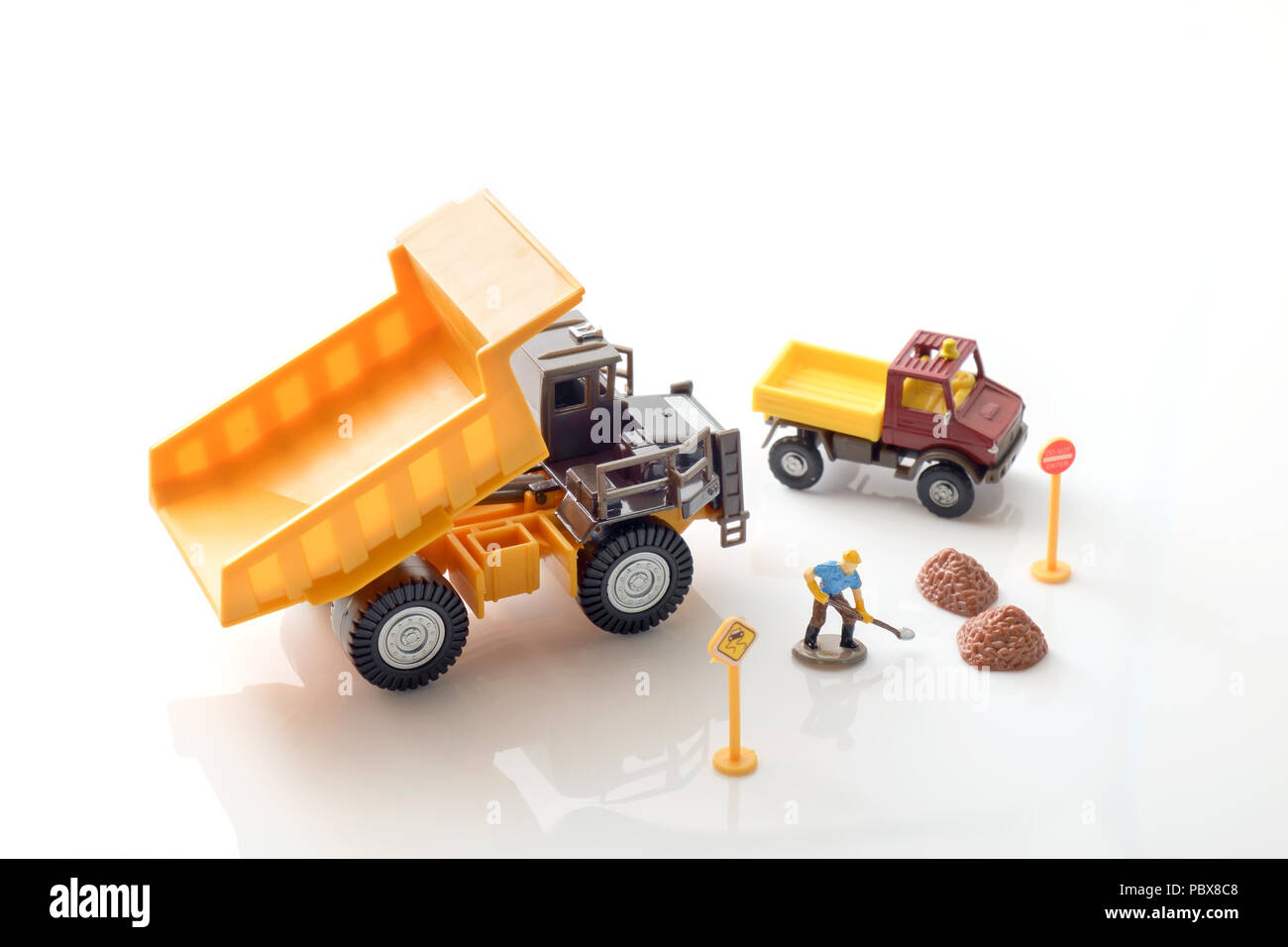 View of construction site of mini toy worker on white background Stock ...