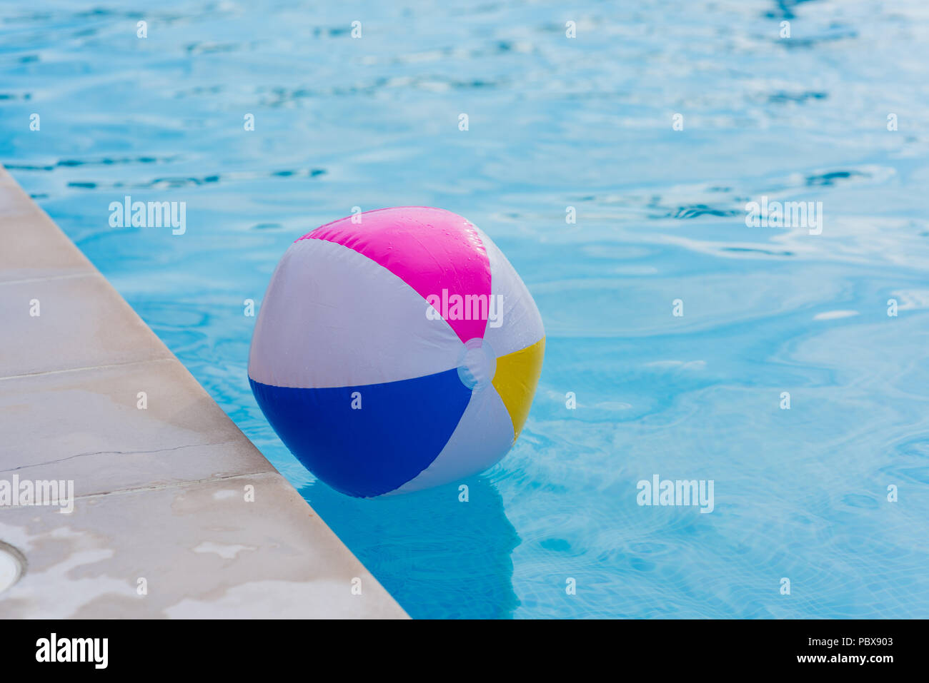 Ball in swimming pool Stock Photo - Alamy