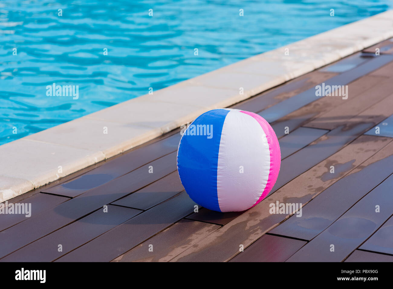 Colorful ball in swimming pool area Stock Photo - Alamy
