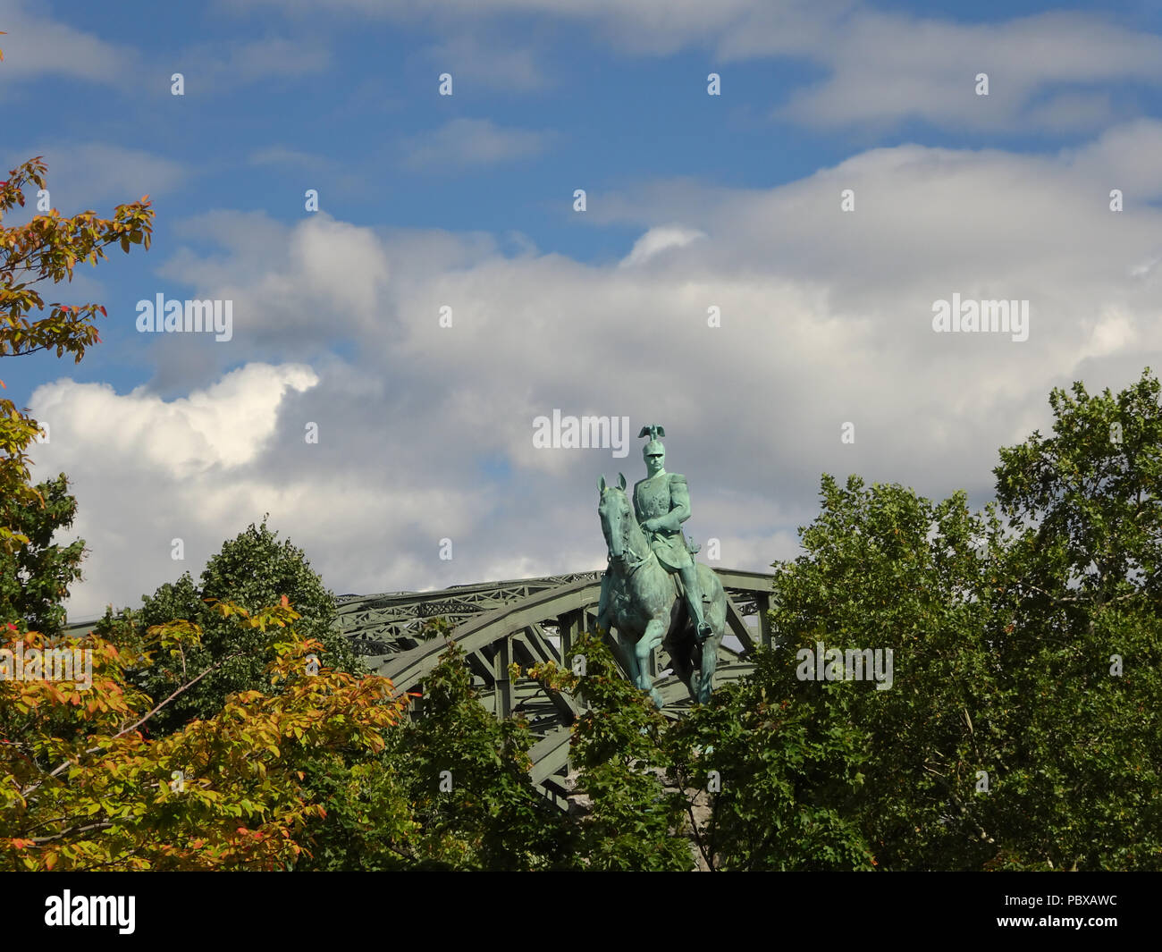 Statue of Wilhelm in Cologne in front of the Hohenzollern Bridge with ...