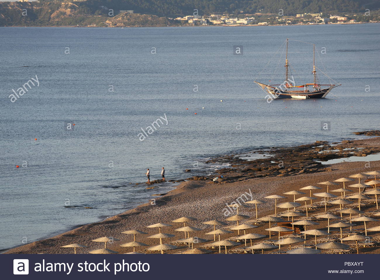 A sailing ship lies in an inlet off the island of Rhodes Stock Photo ...