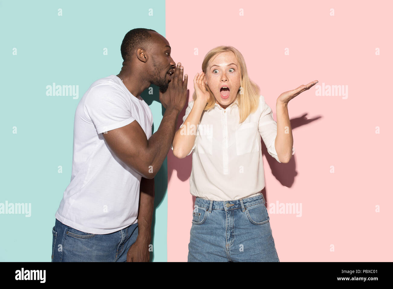 Telling a secret hi-res stock photography and images - Alamy