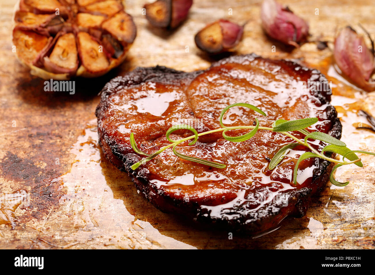 Fried grilled pork neck with garlic on rustic background Stock Photo ...