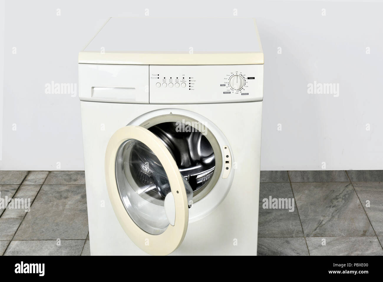 Washing machine with open door in home Stock Photo - Alamy