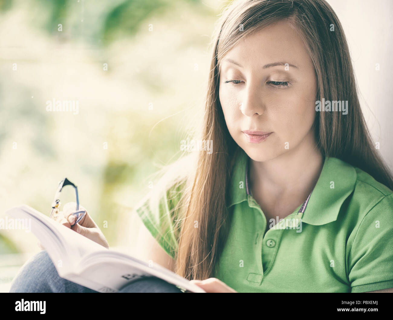 Girl reading book. Girl with a book Stock Photo - Alamy