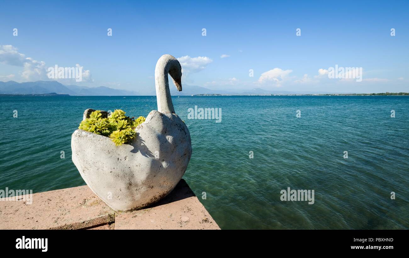 Ornamental swan statue overlooking Garda Lake, Italy Stock Photo - Alamy