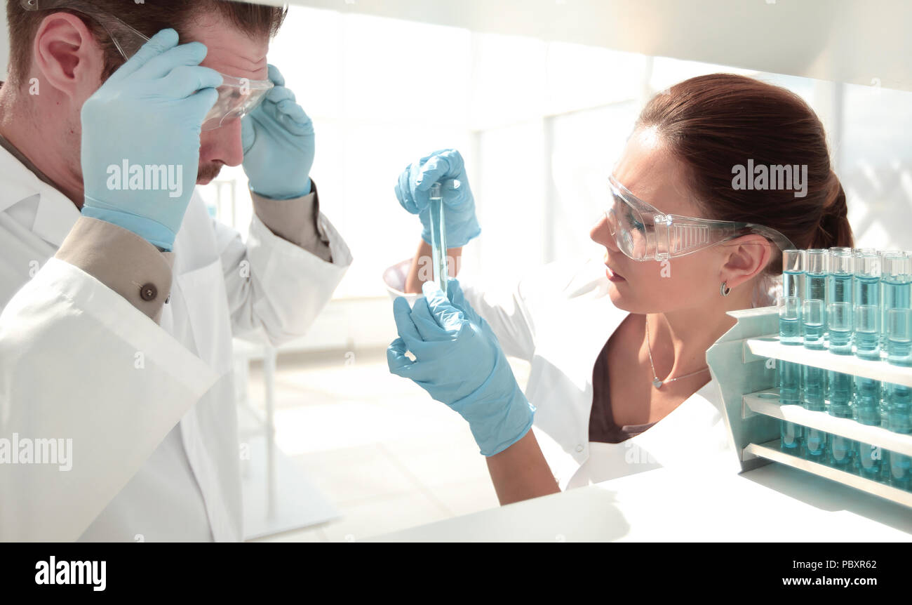 Close up researchers in chemistry lab hi-res stock photography and ...