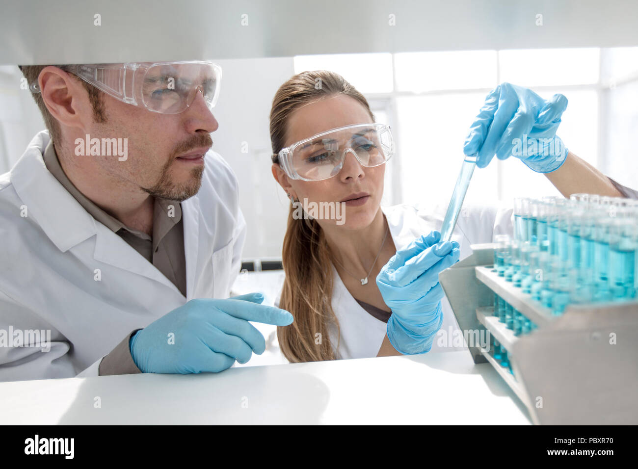two scientists doing tests in the laboratory Stock Photo - Alamy