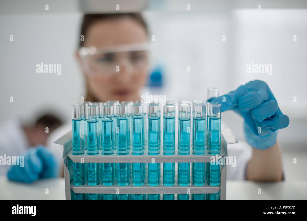 Test tube in scientist hand in laboratory Stock Photo - Alamy