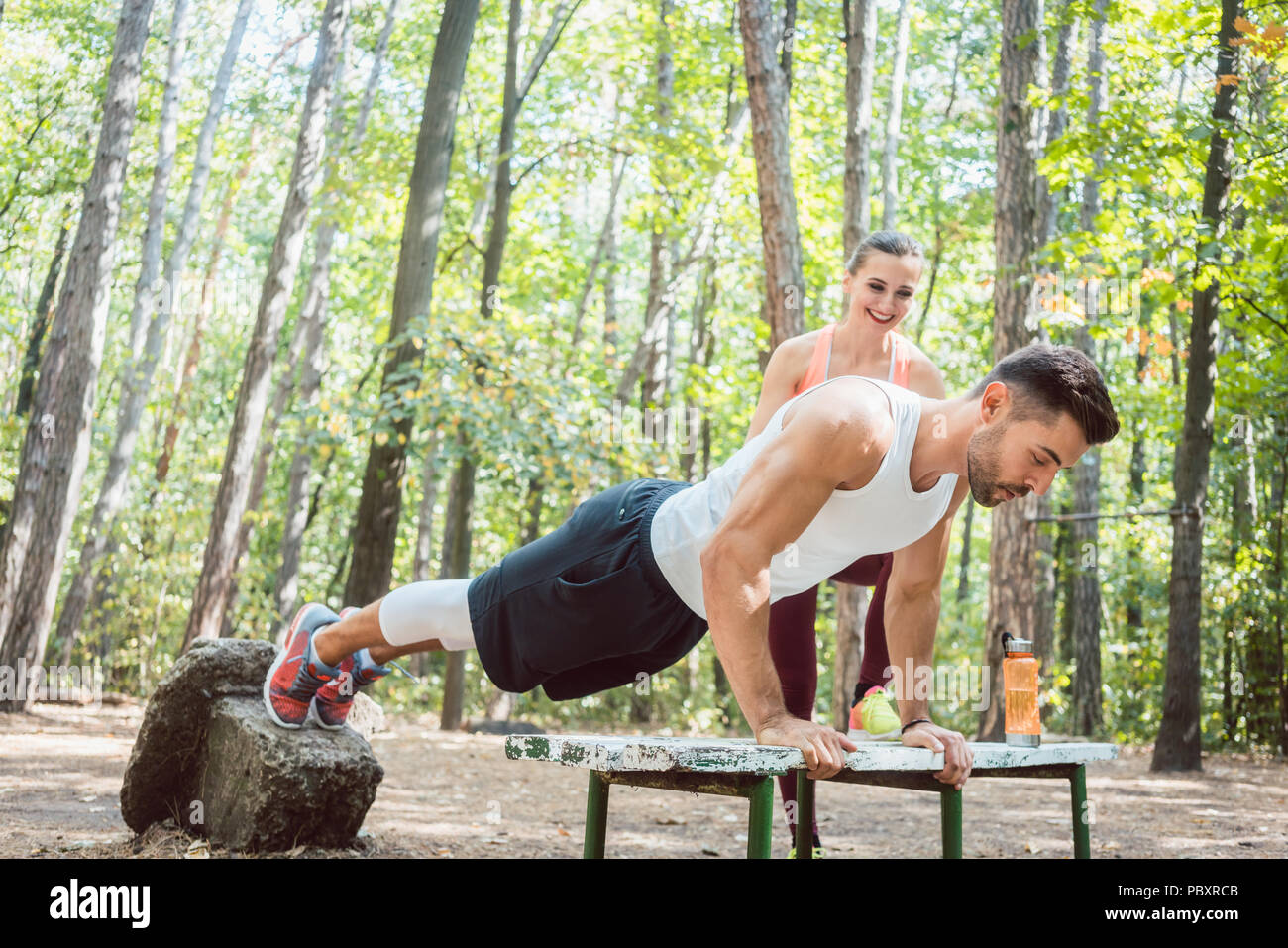 Sporty man doing push-up in an outdoor gym Stock Photo - Alamy