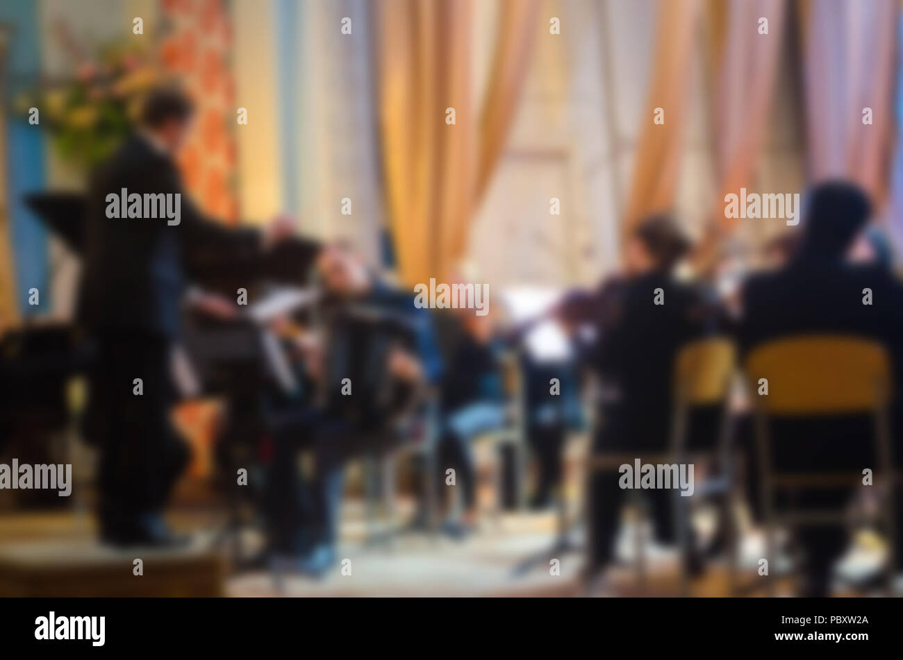 Orchestra conductor manages the orchestra. musical concept. blurred ...